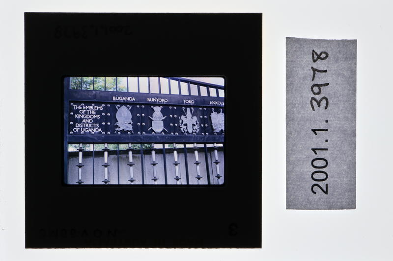 35mm slide: Emblems on black fence - Canterbury Museum